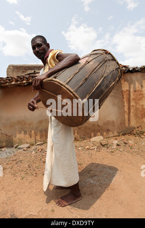 Tribal musician playing a traditional musical instrument, Nagada Stock ...