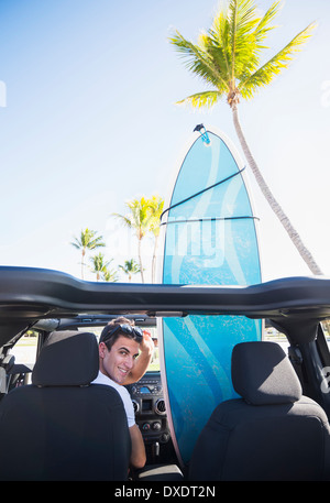 Young caucasian man inside a car using a smartphone Stock Photo - Alamy