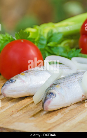 Mugil cephalus fish with vegetables Stock Photo - Alamy