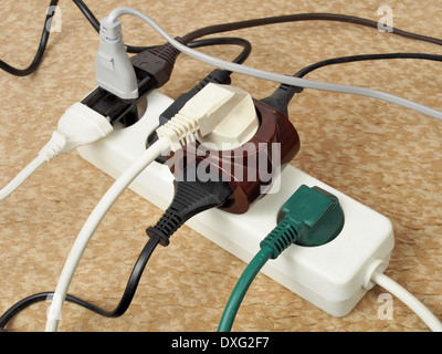 Overloaded extension cord Stock Photo - Alamy