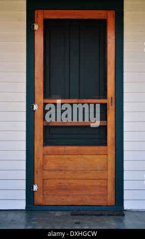 Old antique wooden screen door in a vintage cabin with a covered porch ...