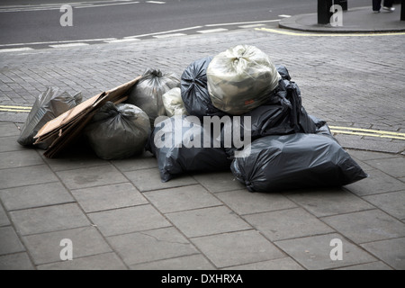 Piles of uncollected rubbish on the streets Piccadilly London England ...