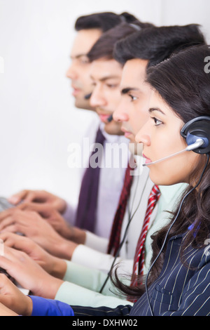 Business employee in formal suits working at table and discussing ...