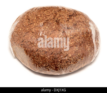 A loaf of round wheat bread wrapped with barbed wire, white background ...
