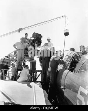 I WANTED WINGS DIRECTOR, MITCHELL LEISEN, STANDING ON STEP LADDER, WITH ...