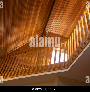 Slanted wooden ceiling above railing in house Stock Photo - Alamy