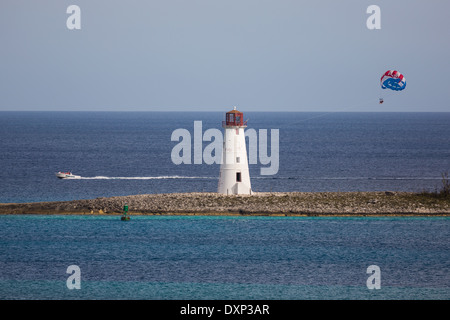 A parasail passes Paradise Island Lighthouse, Nassau, Bahamas ...
