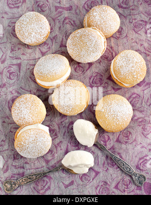 Sponge kisses with cream Stock Photo - Alamy