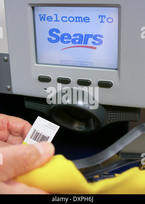 Man Checking Price Tag at Electronic Self Service Price Check Machine ...