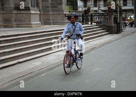 Security Guard riding a push bike, Rizal Park, Manila, Philippines ...