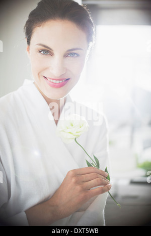 A woman in a white robe on a black background, a dancer, dramatic dance ...
