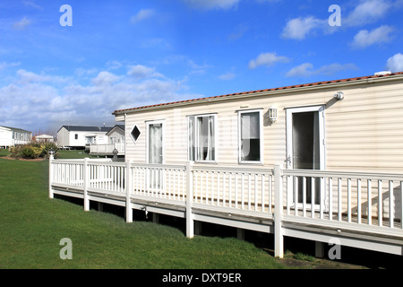 Side view of a modern white caravan on a trailer park Stock Photo - Alamy