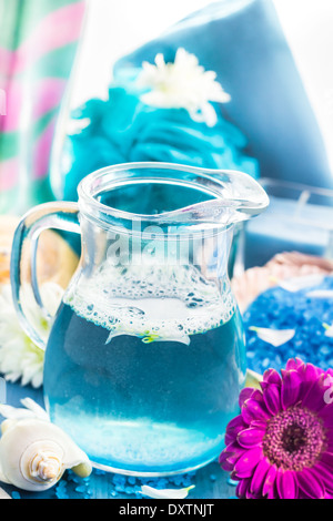 Relaxing spa bath: aromatic salt, shells and flowers Stock Photo - Alamy