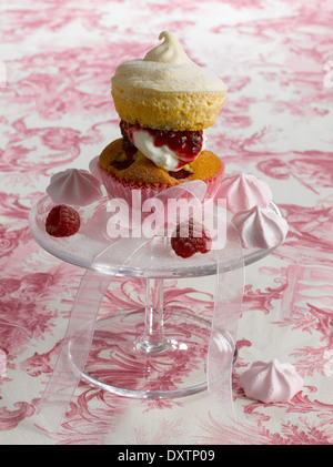 Cupcake with pink cream in the style of Barbie with a sign for text ...