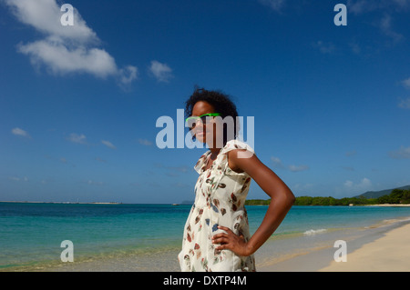 WEST INDIES Caribbean Grenada Carriacou People in distance walk on ...