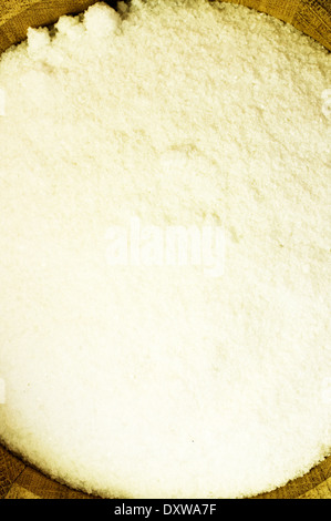 Dietary salt in the wooden tub closeup Stock Photo - Alamy