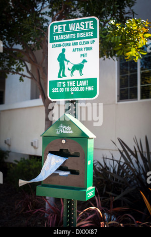 Pet waste station with dog bag dispenser Stock Photo - Alamy