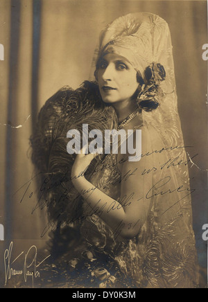 Opera singer Amelita Galli-Curci beside a portrait of herself by ...
