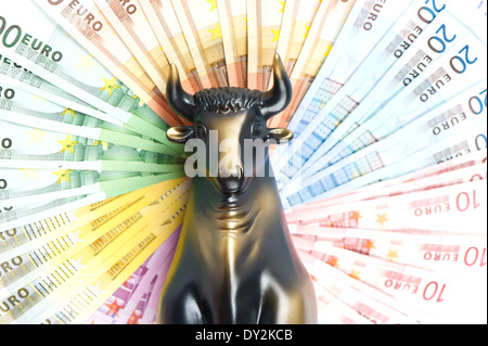 golden bull on euro money background. stock, business and finance ...