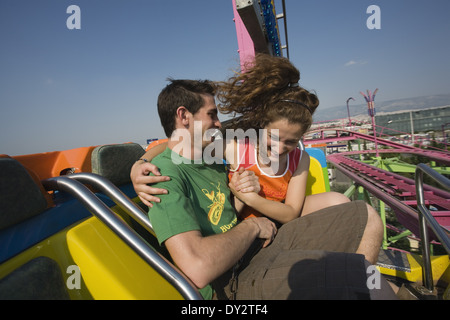 Teenage couple on a roller coaster ride Stock Photo - Alamy