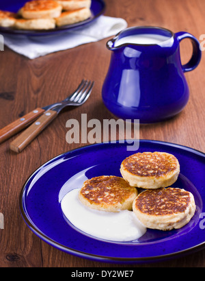 Fried homemade cottage cheese syrniki for breakfast Stock Photo - Alamy