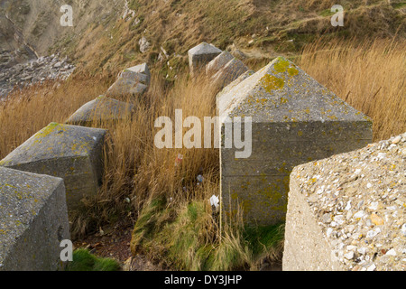 WWII anti tank defense. Blocks of concrete lining the beach head on the ...