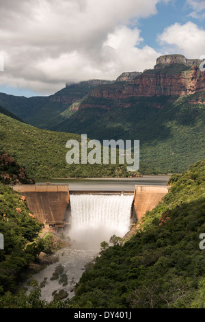 the swadini dam waterfall near the blyde river with the dragensberg as ...