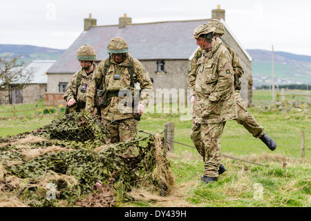 Soldiers enter a forward observation post in a rural location of ...