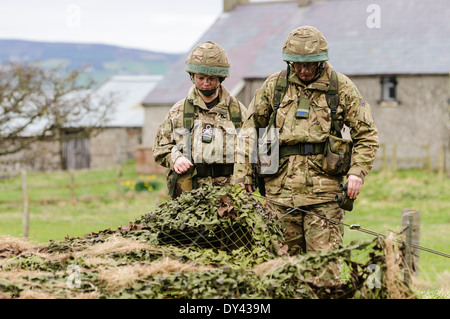 Soldiers enter a forward observation post in a rural location of ...