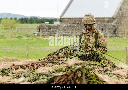 A soldier enters a forward observation post in a rural location of ...