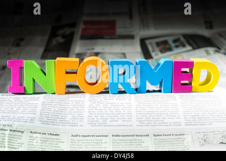 Word informed on newspaper Stock Photo - Alamy