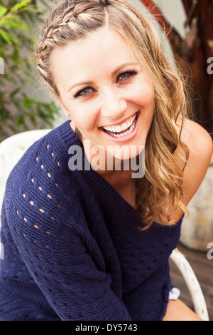 Young beautiful woman wearing sweater and pointing with finger to the ...