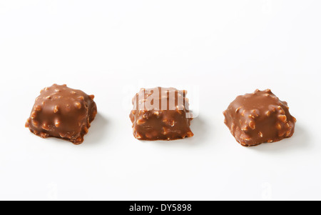 Chocolate pralines with chopped nuts Stock Photo - Alamy