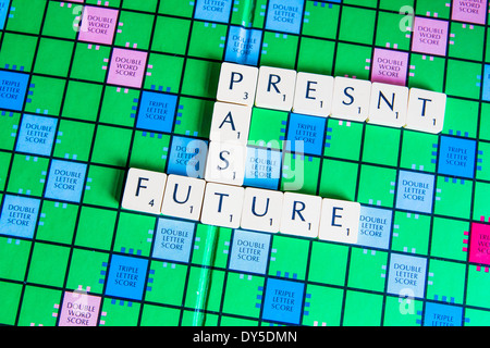 The words Present and past spelled out with scrabble letters on a ...