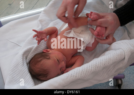 Newborn baby being changed Stock Photo - Alamy