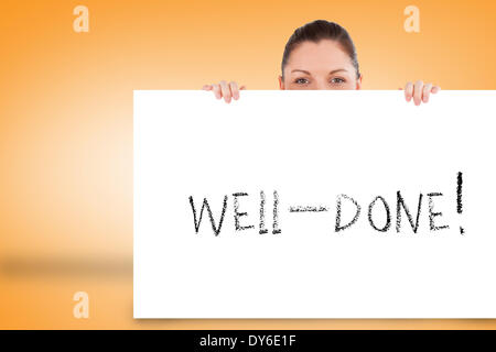 Woman smiling and showing well done with notebook Stock Photo - Alamy