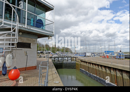 Entrance lock to Shotley Marina, Suffolk,Uk with control tower on the ...