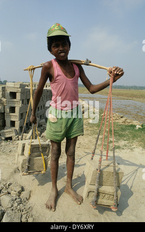 India Westbengal , children work in brick industry, children carry ...