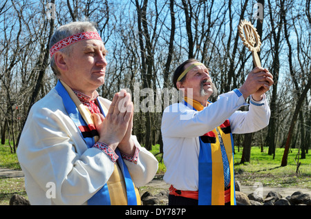 Proto-Slavic pagan rituals in Ukraine. Priest carries fire around the ...