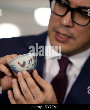 Nicolas Chow, Sotheby’s Asia Deputy Chairman, holds the Chinese Song ...