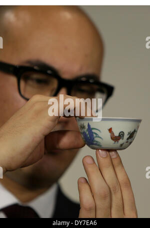 Nicolas Chow, Sotheby’s Asia Deputy Chairman, holds the Chinese Song ...