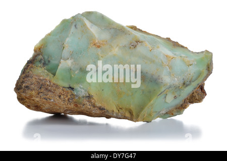 Natural rough Green Opal stone from Madagascar on a tree bark in the ...