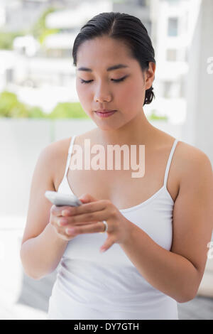 Pretty young Asian woman on grey background with space for text Stock ...