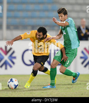 KUWAIT CITY, Kuwait - Kuwait's Hamad Aman (R) scores in the second half ...