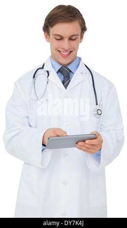 smiling male doctor with tablet pc Stock Photo - Alamy