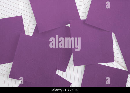 Purple paper strewn over notepad paper Stock Photo - Alamy