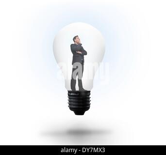 Young businessman with light bulb in idea concept Stock Photo - Alamy