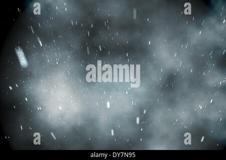 Cloudy sky with snow falling Stock Photo - Alamy