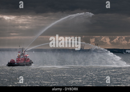 small fireboat demonstrating its capabilities on Baltic Sea in Gdansk ...