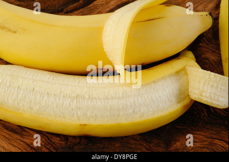 Fresh bananas on wooden background Stock Photo - Alamy